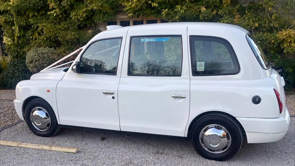 White Electric Taxi Cab for Wedding hire in London and Home counties