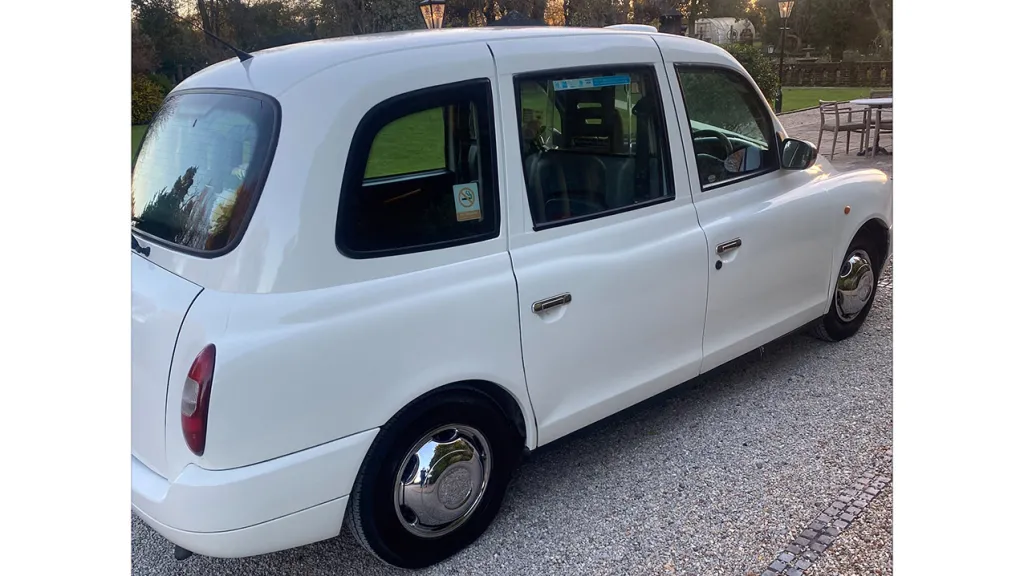 White Electric Taxi Cab for Wedding hire in London and Home counties