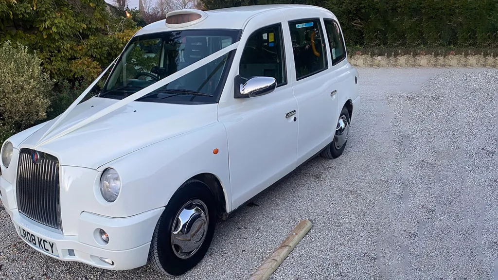 White Electric Taxi Cab for Wedding hire in London and Home counties