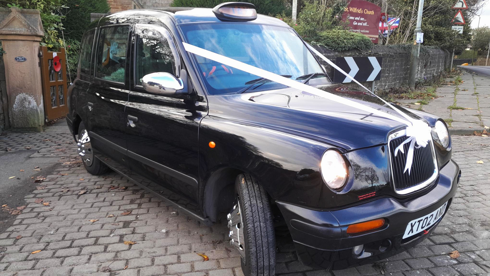 Modern Black Taxicab available to hire for weddings