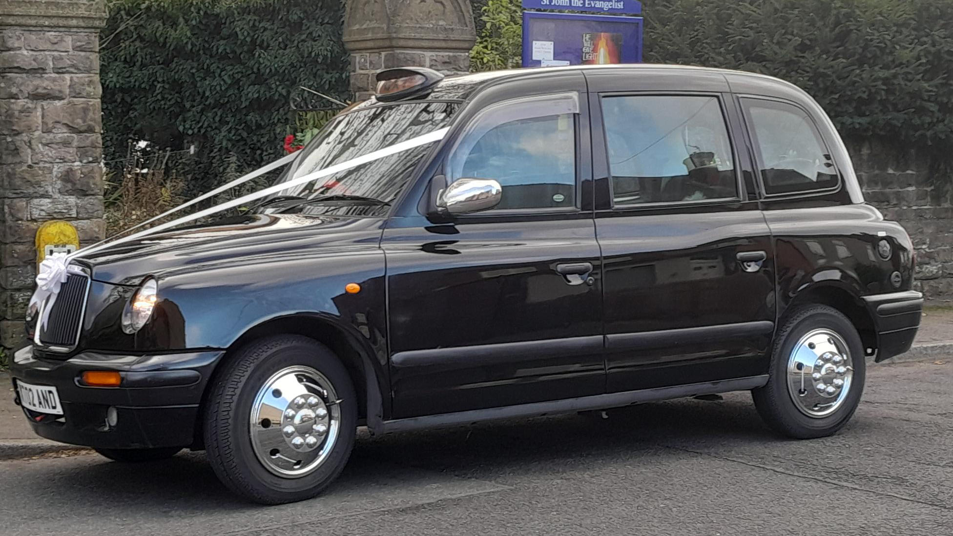 Modern Black Taxicab available to hire for weddings