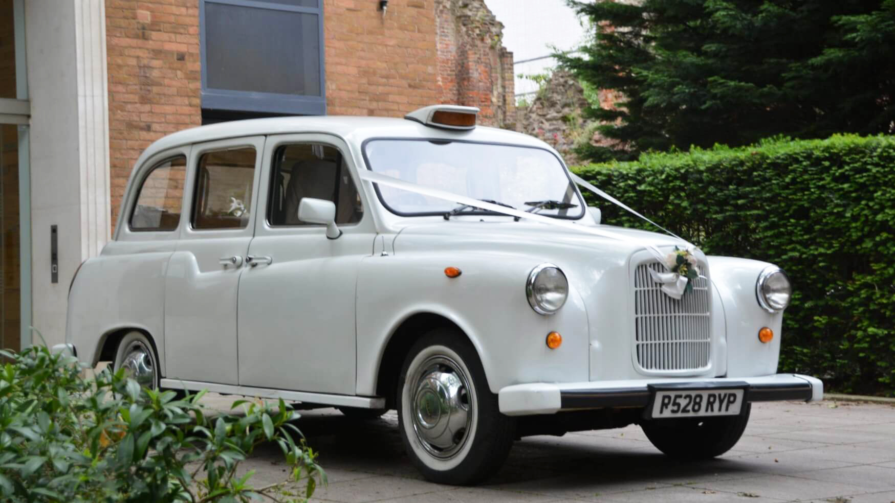 White Electric Taxi Cab for Wedding hire in London and Home counties