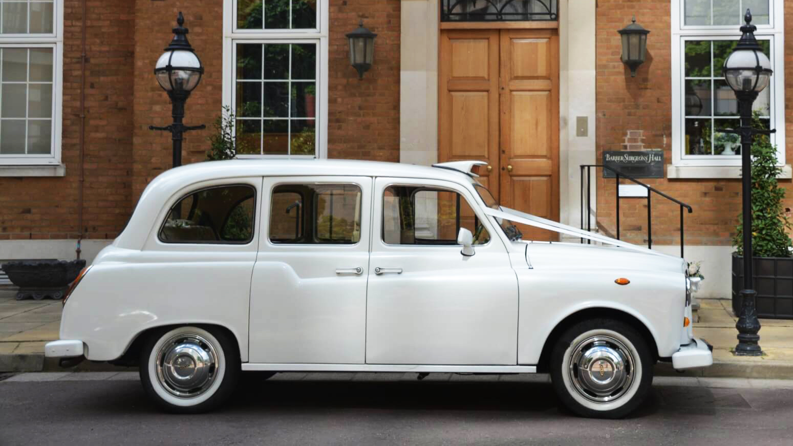 White Electric Taxi Cab for Wedding hire in London and Home counties