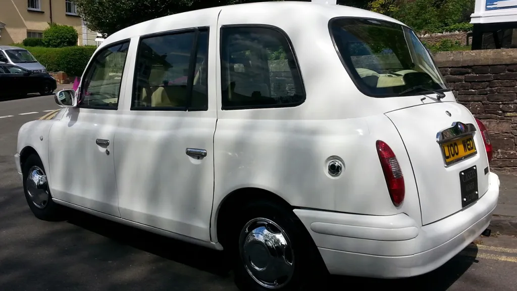 White Electric Taxi Cab for Wedding hire in London and Home counties