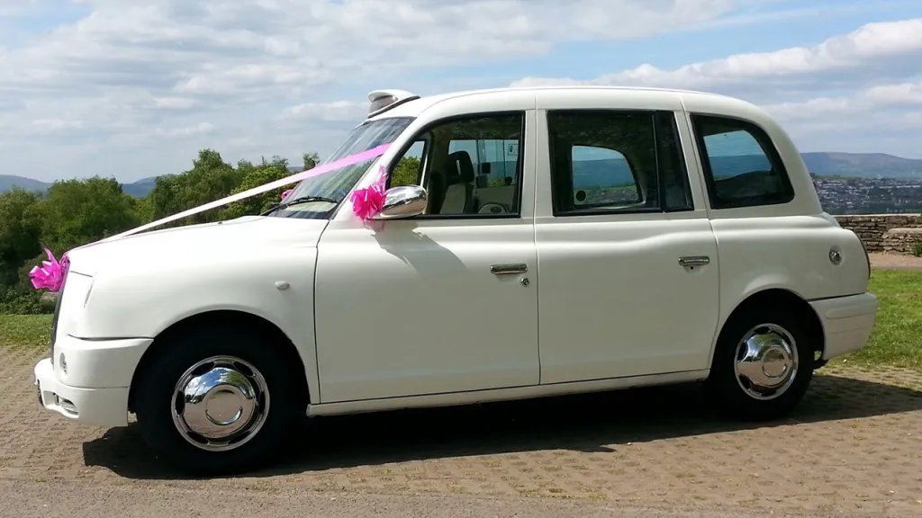 White Electric Taxi Cab for Wedding hire in London and Home counties