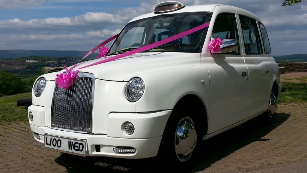White Electric Taxi Cab for Wedding hire in London and Home counties