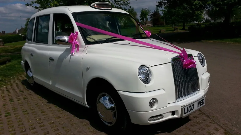 White Electric Taxi Cab for Wedding hire in London and Home counties