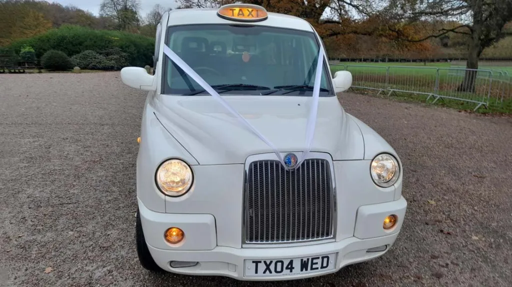 White Modern TX4 Taxi Cab for wedding hire in Nottinghamshire