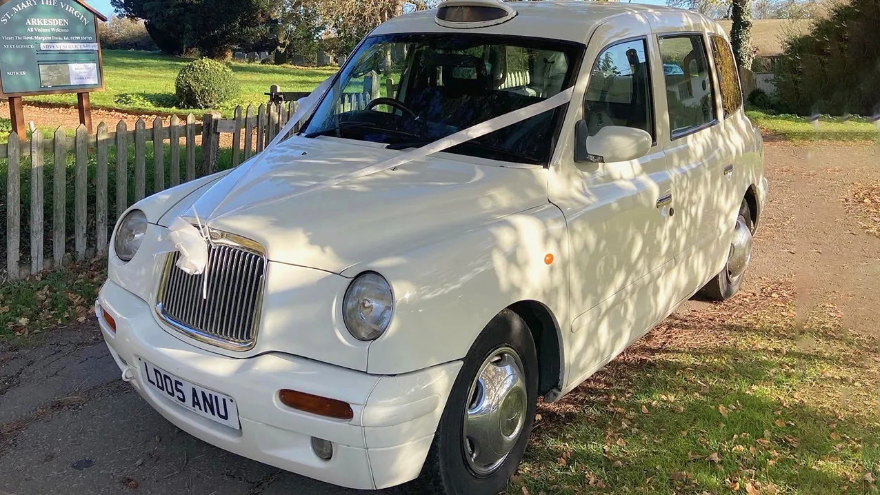 White Modern Taxi Cab for wedding hire in Essex and London