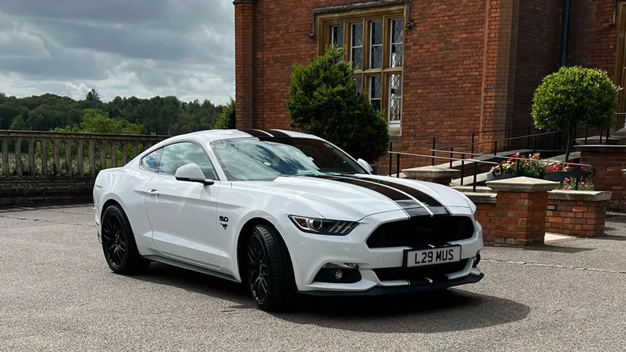 Modern White Ford Mustang 5L GT Fastback for wedding hire