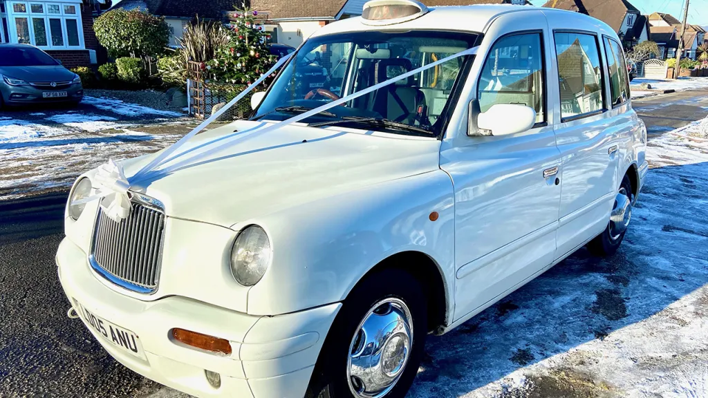 White Modern Taxi Cab for wedding hire in Essex and London